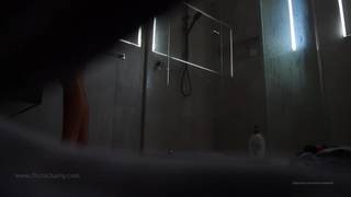 Hidden camera in a public shower filming this naked woman!